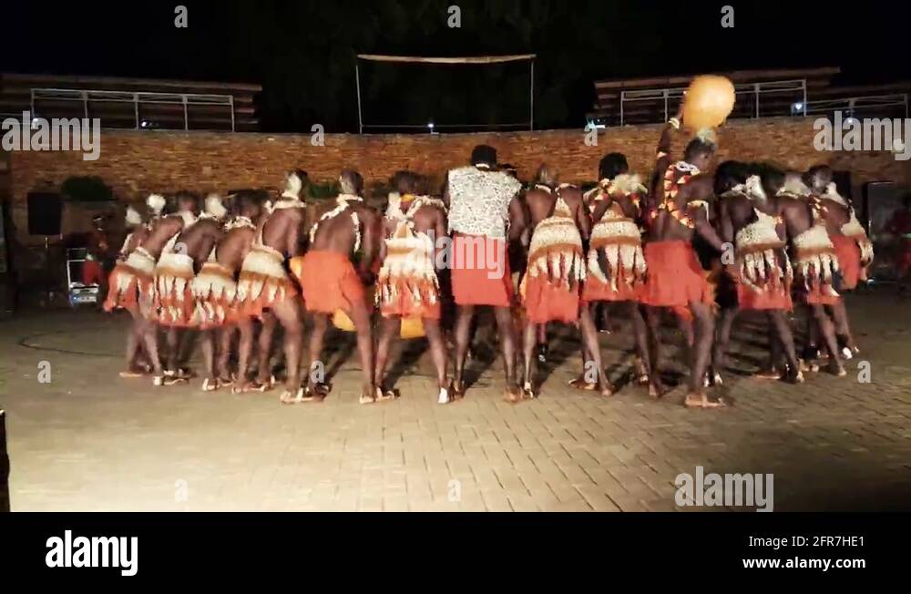 African tribe dancers, tribesmen tribeswomen dance sing songs drum jump ...