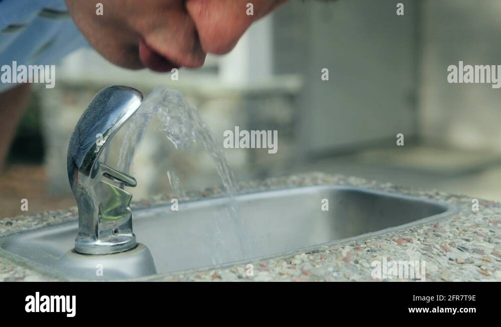 Man getting drinking water from drinking water fountain Stock Videos ...