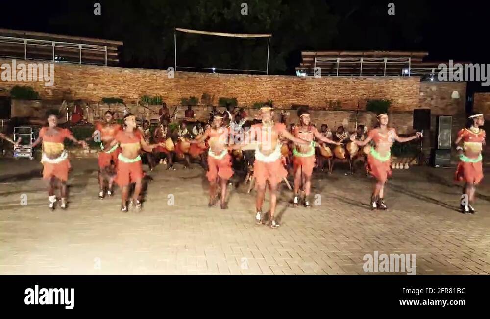 African tribe dancers, tribesmen tribeswomen dance sing songs drum jump ...