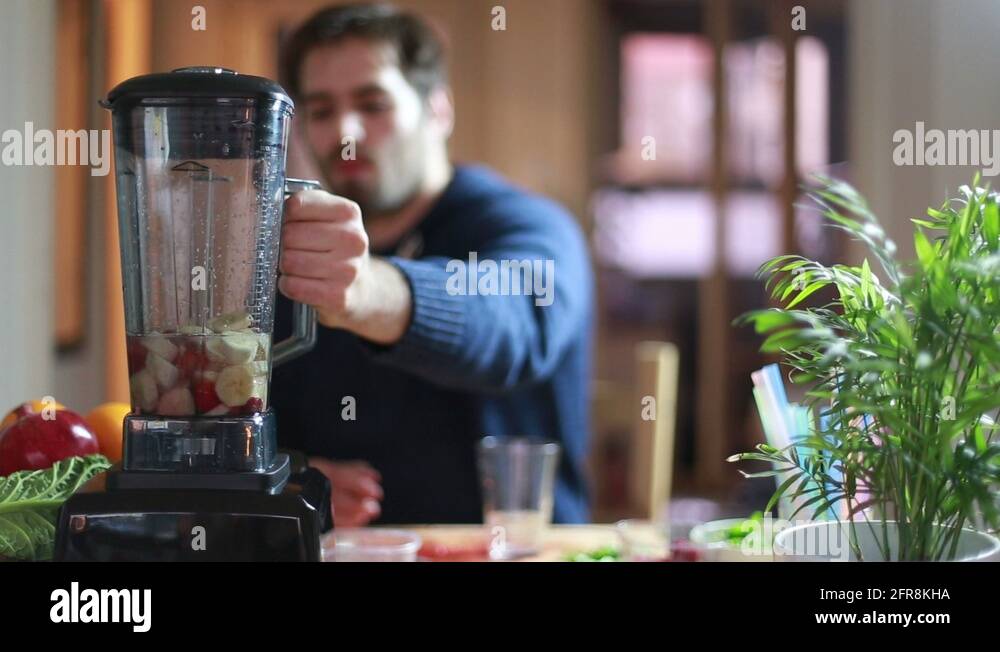 Man blending fruits in blender Stock Video Footage - Alamy