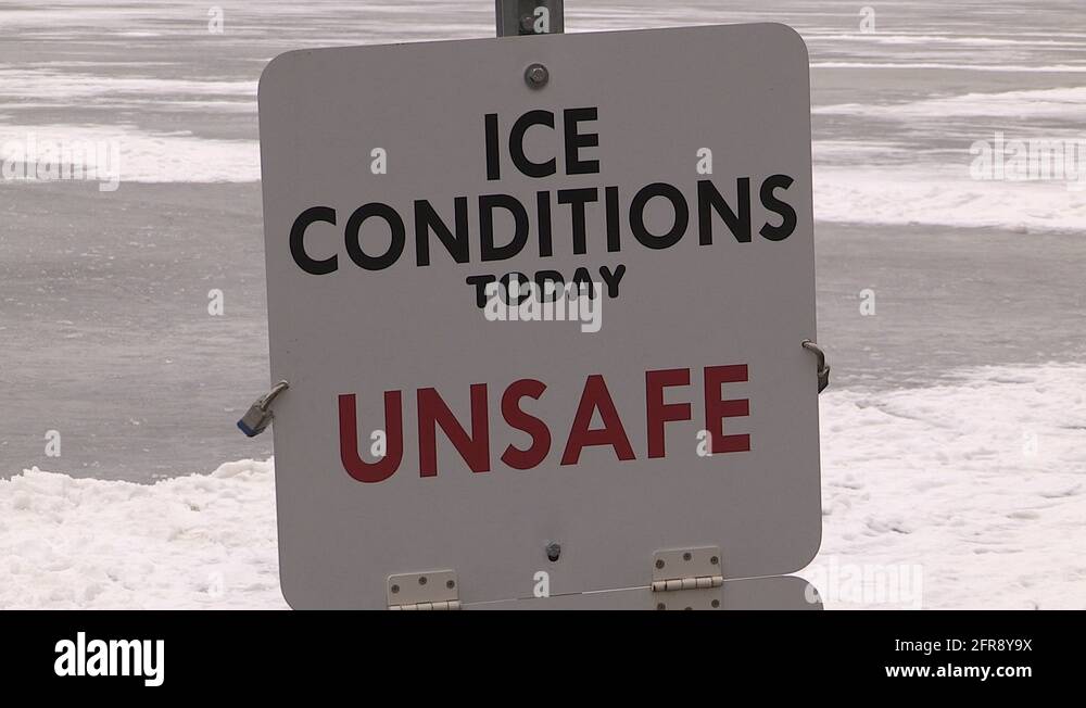 Dangerous unsafe thin ice warning signs at pond Stock Video Footage - Alamy