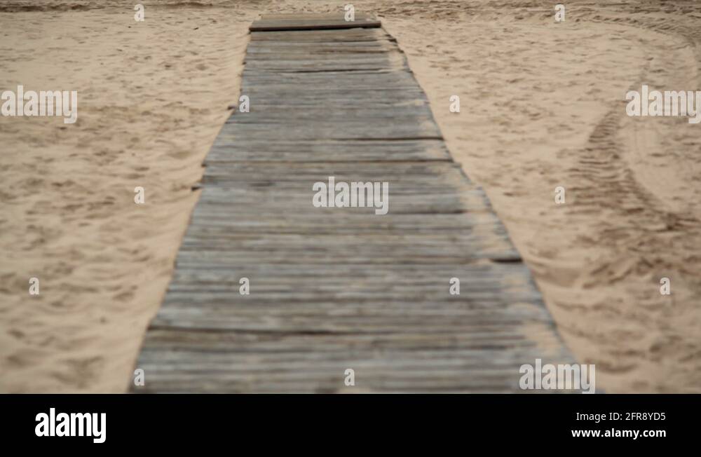 Wooden plank path beach ocean horizon, foggy mist, tilt up, Portugal ...