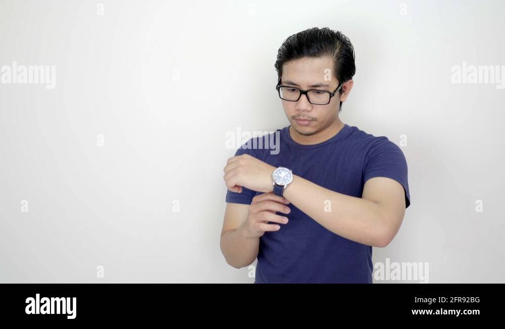 Asian Man Wearing Watch on His Hand On Studio White Background 4K ...