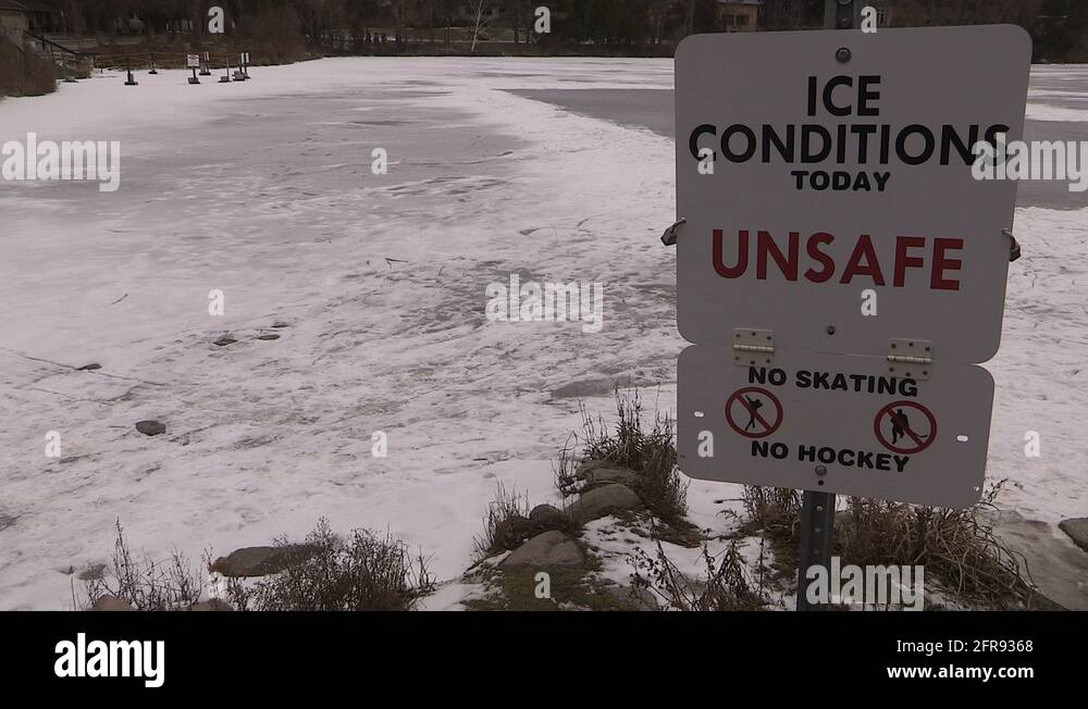 Dangerous unsafe thin ice warning signs at pond Stock Video Footage - Alamy