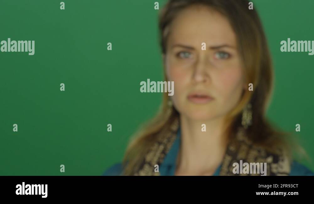 Beautiful Woman Looking Stressed Out On A Green Screen Background