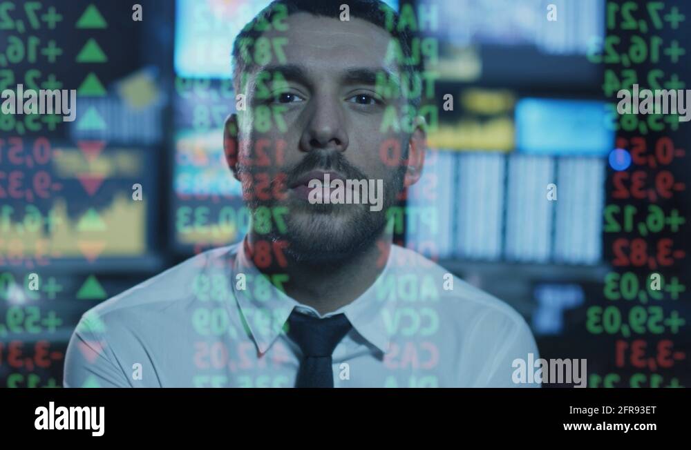 Stockbroker is looking at data with numbers on a transparent glass ...