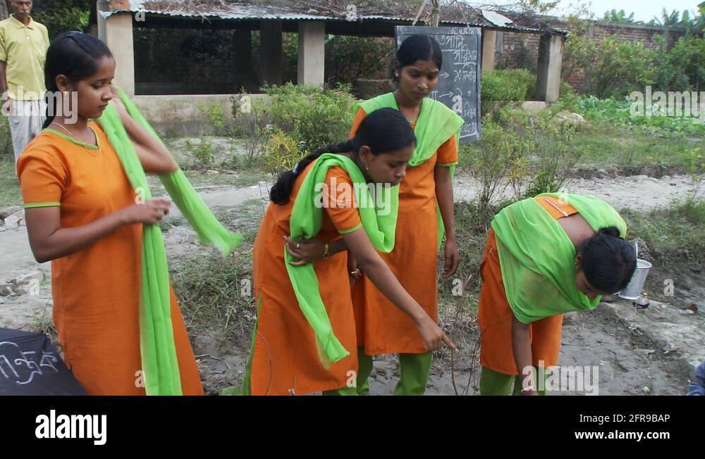 Four Indian women demonstrating a harvest technique Stock Video Footage ...