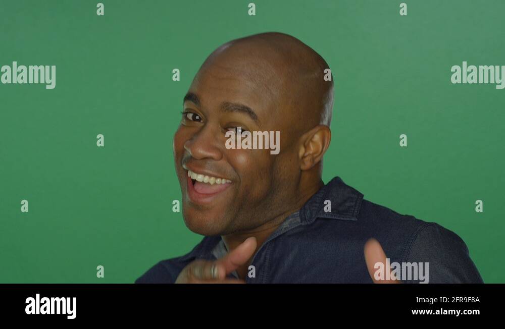 African American man acting goofy, on a green screen background Stock ...