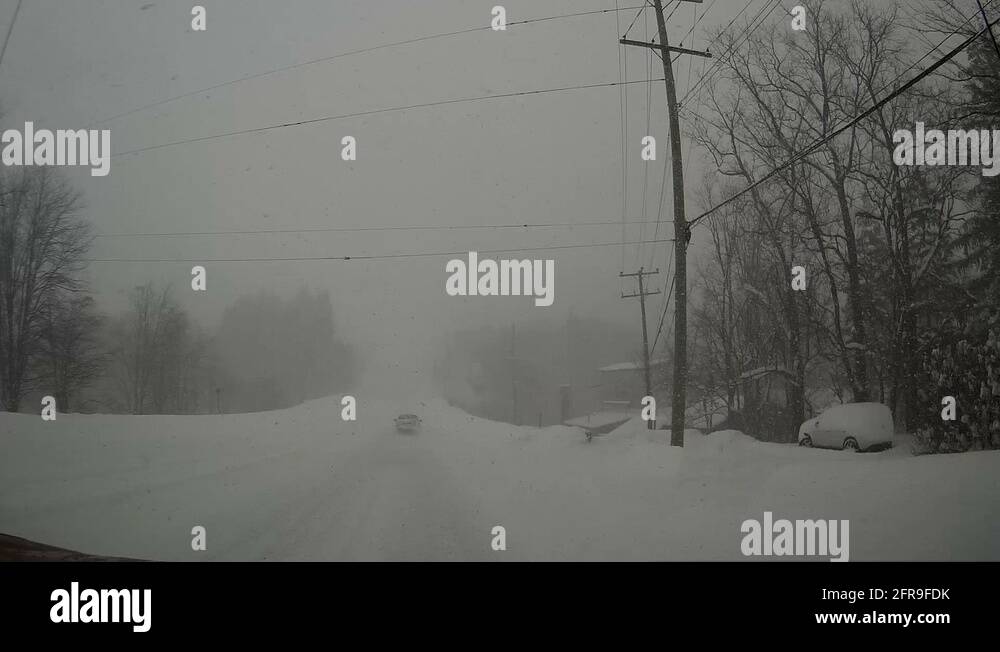 POV Dashcam driving in snowstorm and blizzard conditions Stock Video ...