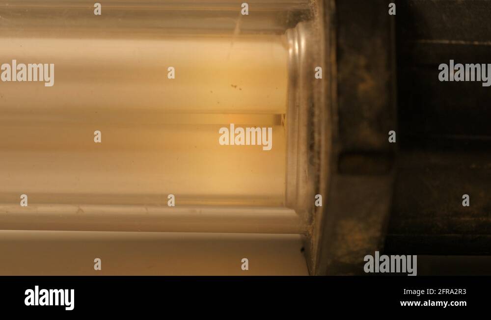 Flickering CFL Lightbulb tube on a black background, 4K Stock Video ...