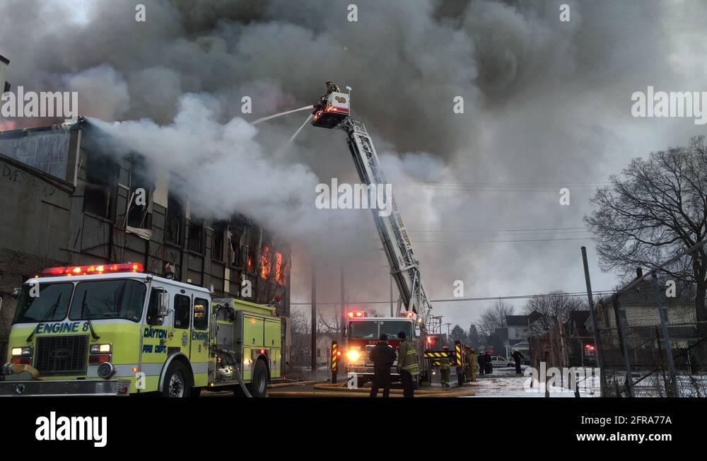 Water sprayed on fire at abandoned warehouse building 4k Stock Video ...