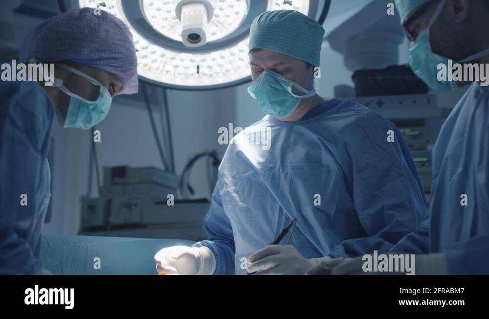 Medical Team Performing Surgical Operation in Modern Operating Room ...
