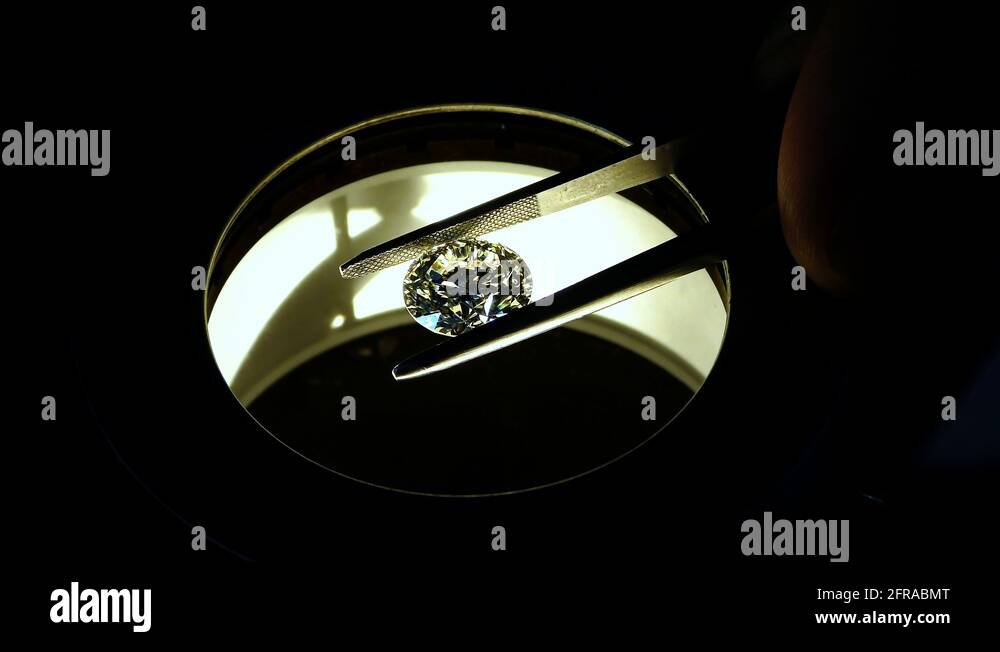 A diamond is examined under the microscope Stock Video Footage - Alamy
