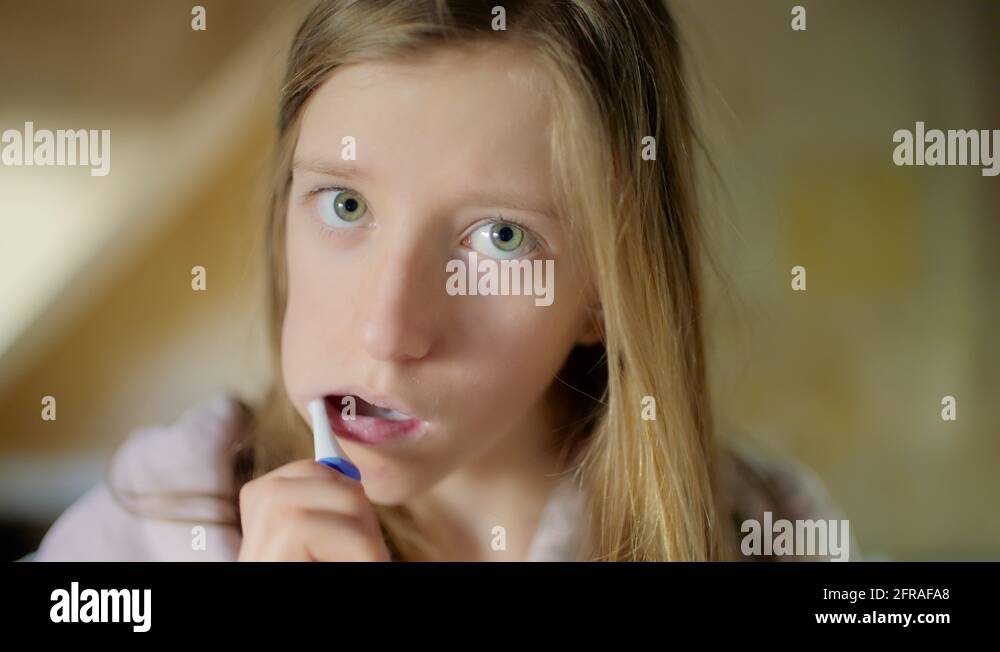 Girl brushing teeth Stock Videos & Footage - HD and 4K Video Clips - Alamy