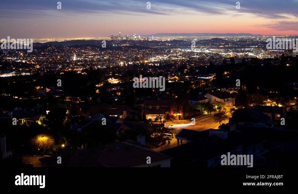 4K wide shot time lapse of the Los Angeles skyline and Glendale suburbs ...
