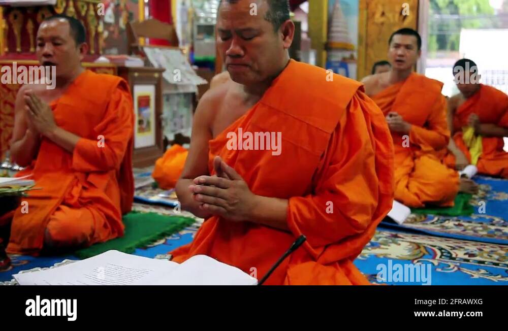 THAILAND: Buddhist monks praying together in a temple - singing ...