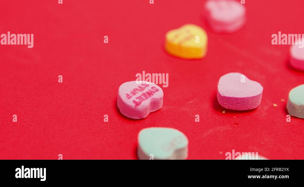Valentine's day candies laying on red background 4k Stock Video Footage ...