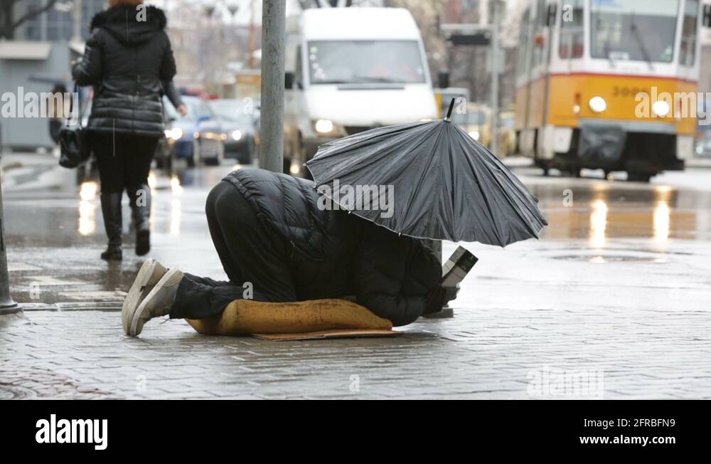 Homeless umbrella rain Stock Videos & Footage - HD and 4K Video Clips ...