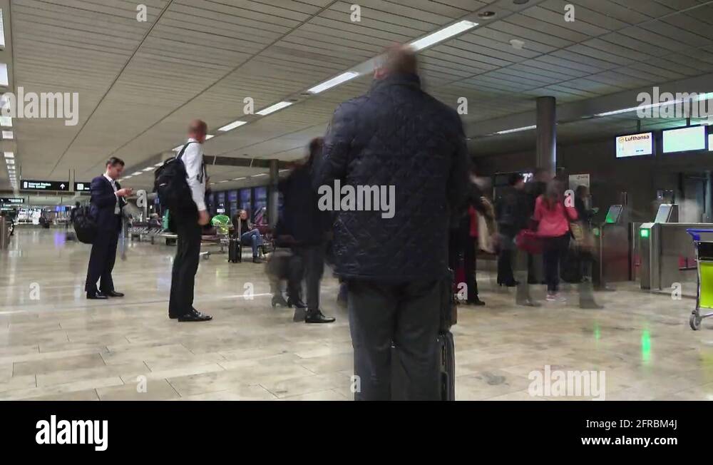 People queue up and pass through automatic boarding gate, time lapse ...