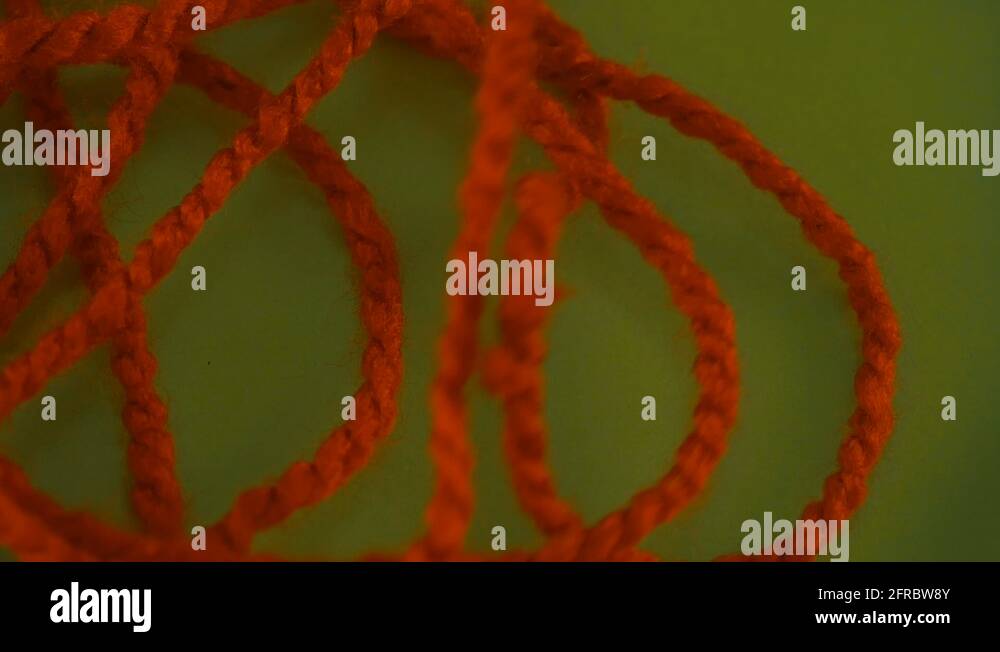 Someone is Pulling Red Thread up Yarn Green Screen Colorful Filament ...