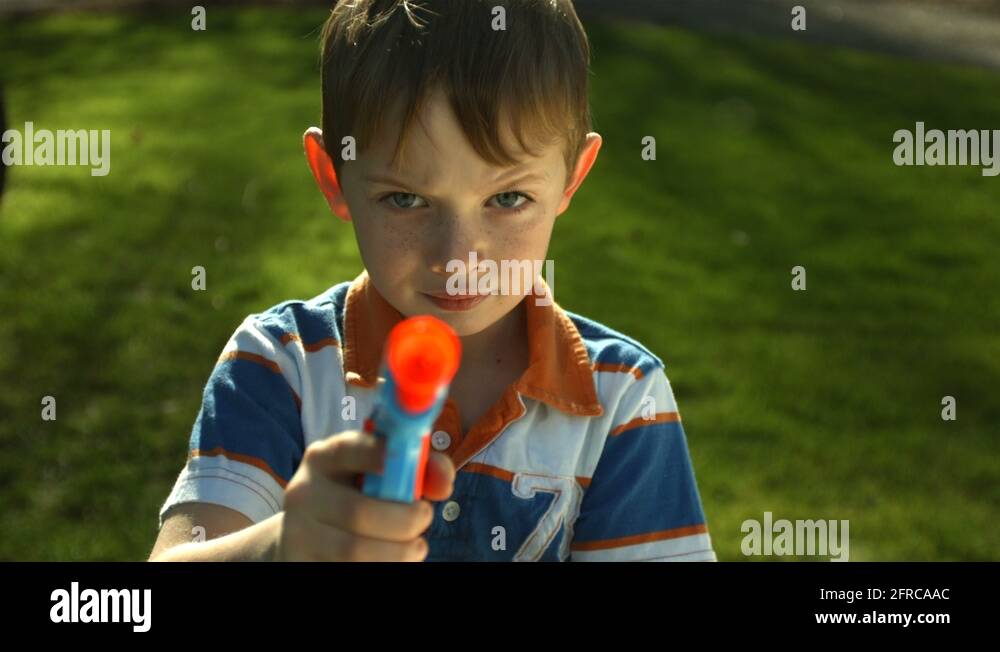 Boy with toy gun Stock Videos & Footage - HD and 4K Video Clips - Alamy