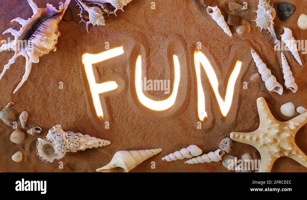 Hand drawing Fun symbol in the sand. Beach background. Top view Stock ...