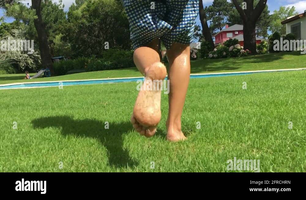 Children running and jumping to the swimming pool water. Kids sprinting ...