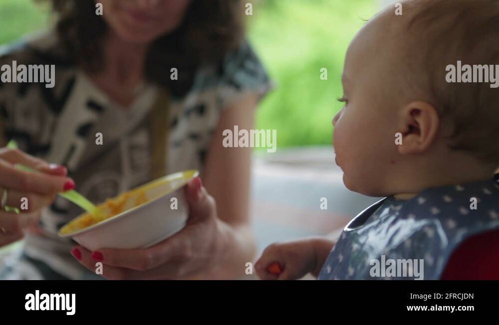 Mother feeding baby Stock Videos & Footage - HD and 4K Video Clips - Alamy