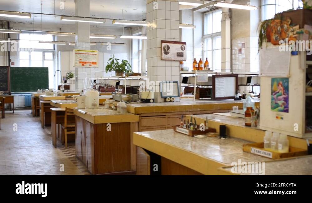 Big empty chemical laboratory with many tables. Text on box: dry salt ...
