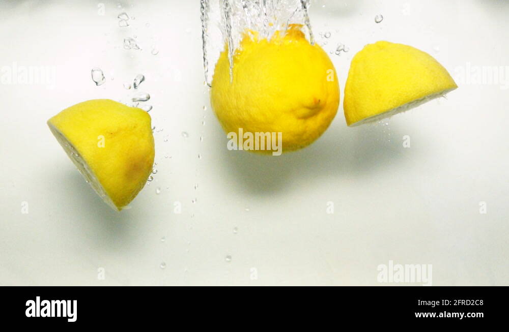 Parts of lemon drops under water. Isolated Stock Video Footage - Alamy