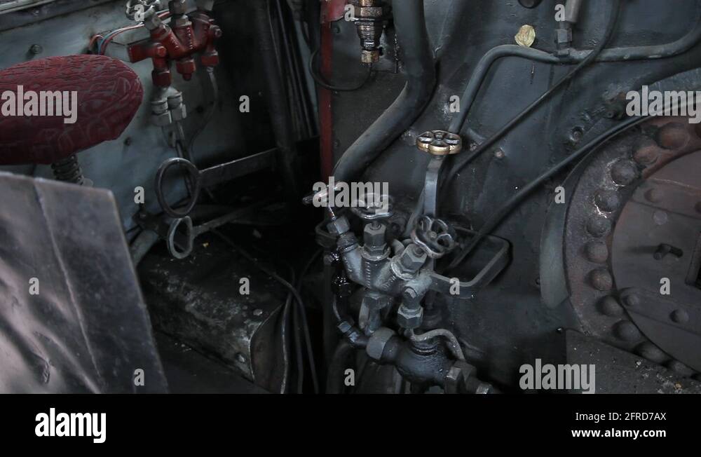 Engine room of an old train steam engine locomotive interior with ...