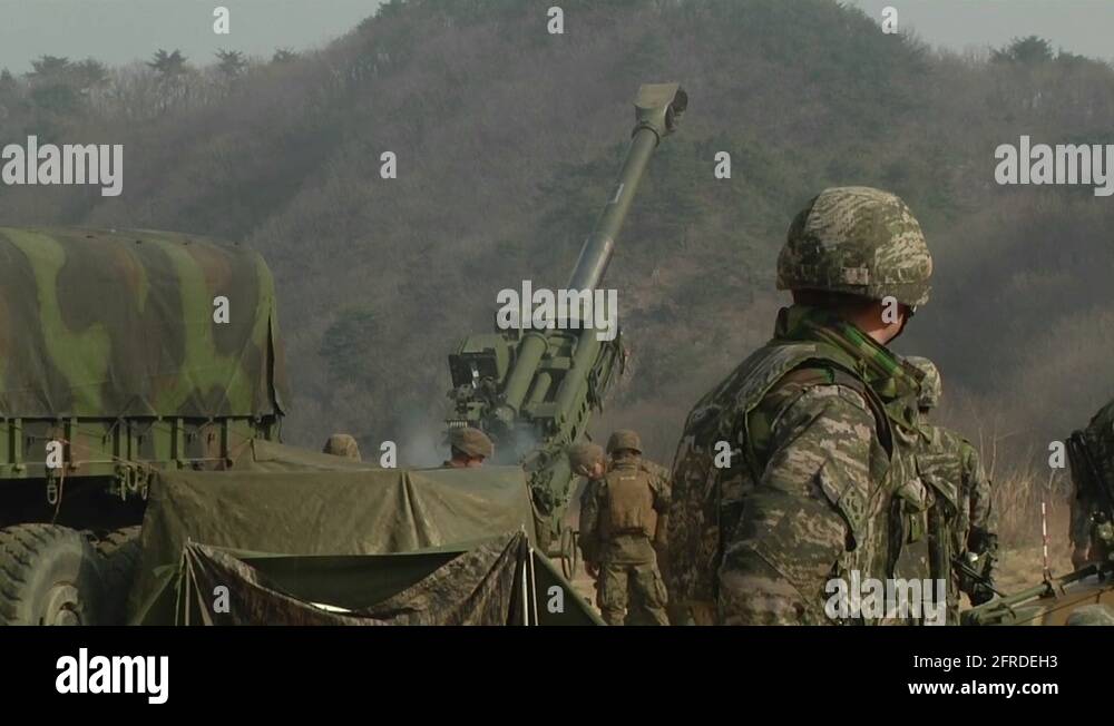 Howitzer Artillery Live Shoot - Wide shot Howitzer Firing Stock Video ...