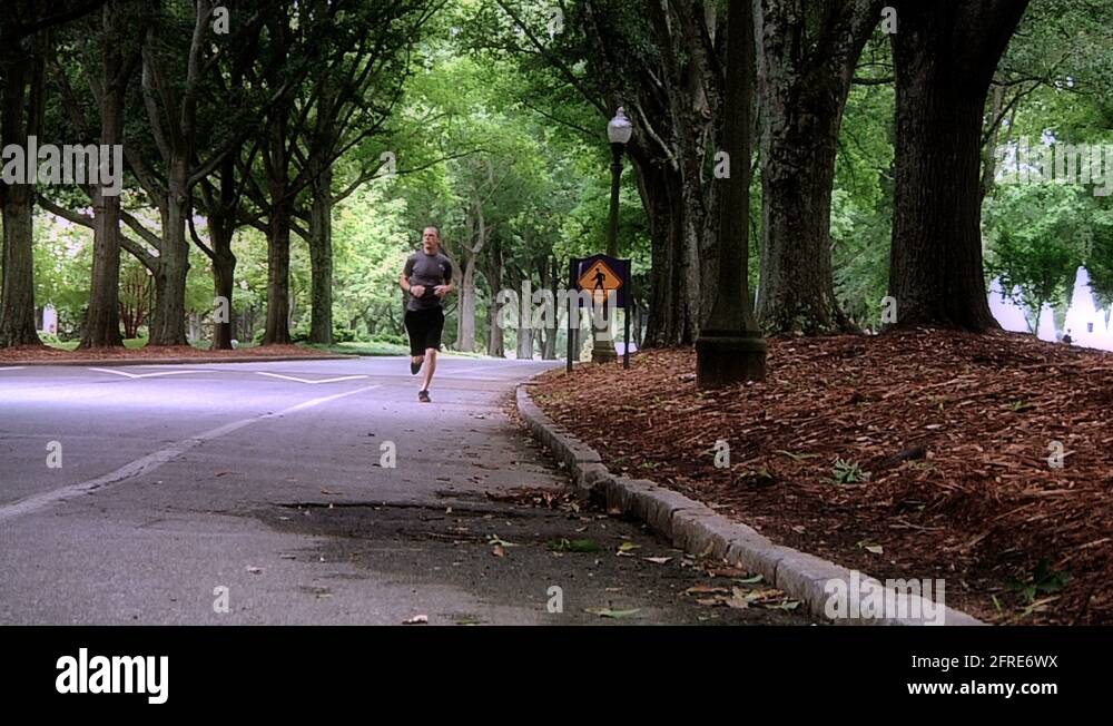 Man jogging on road Stock Videos & Footage - HD and 4K Video Clips - Alamy