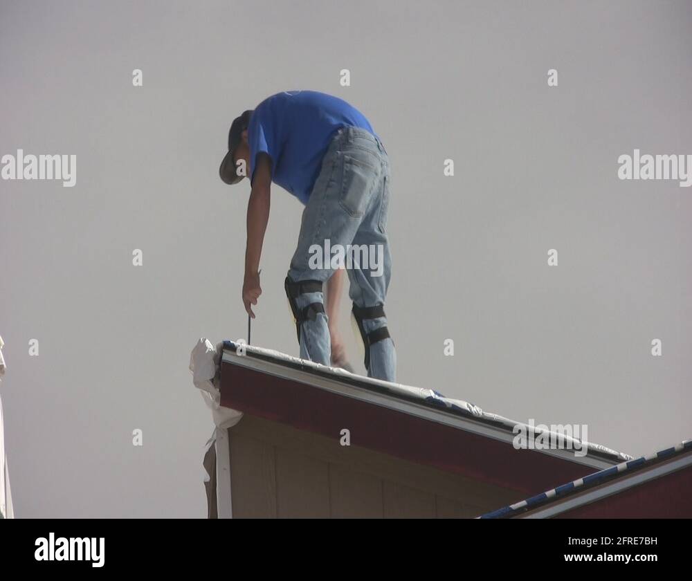 Man roof Stock Videos & Footage - HD and 4K Video Clips - Alamy