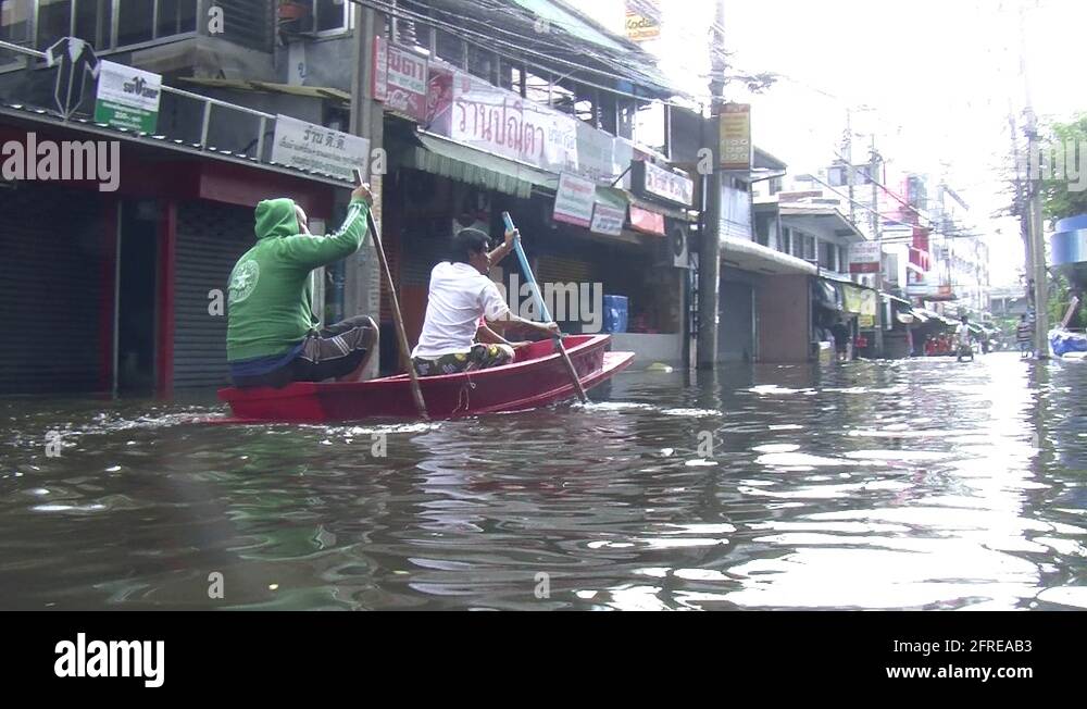 Men in Boat Flood Refugees Flooding Emergency Climate Change Global ...