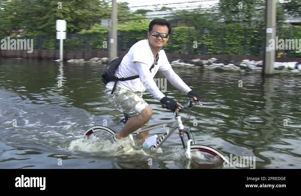 Man riding bike through flood Stock Videos & Footage - HD and 4K Video ...