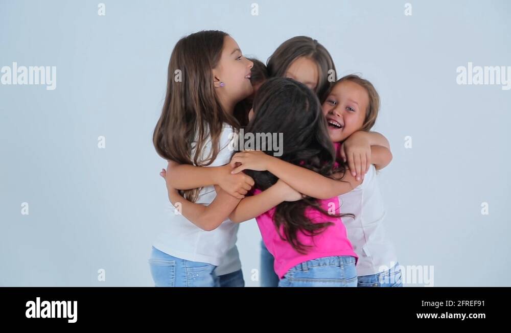Little girls hugging and laughing on the white background Stock Video ...