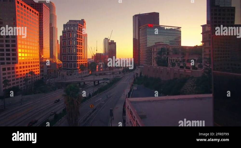 Low altitude aerial view of downtown Los Angeles skyline at sunset. 4K ...