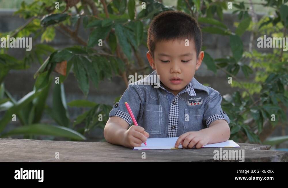 Asian boy writing Stock Videos & Footage - HD and 4K Video Clips - Alamy