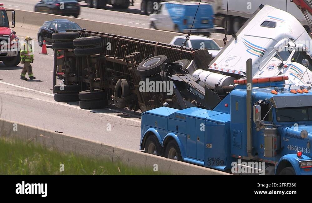 Tractor trailer truck crash on highway with police and firefighters at ...