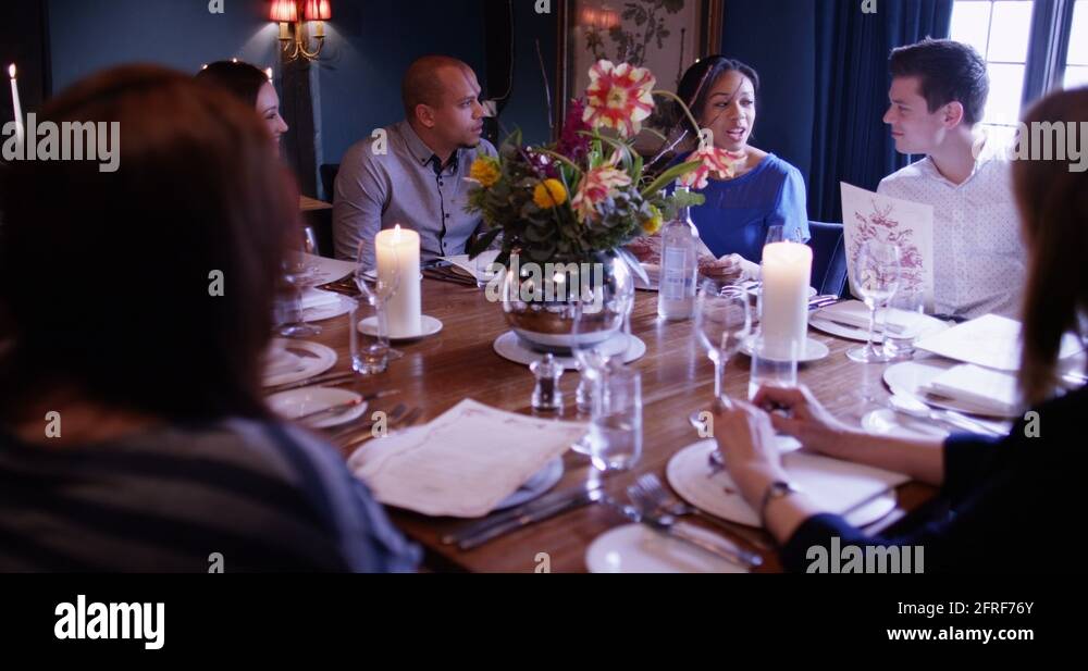4k, Group of attractive people looking at their menu's at a fancy ...