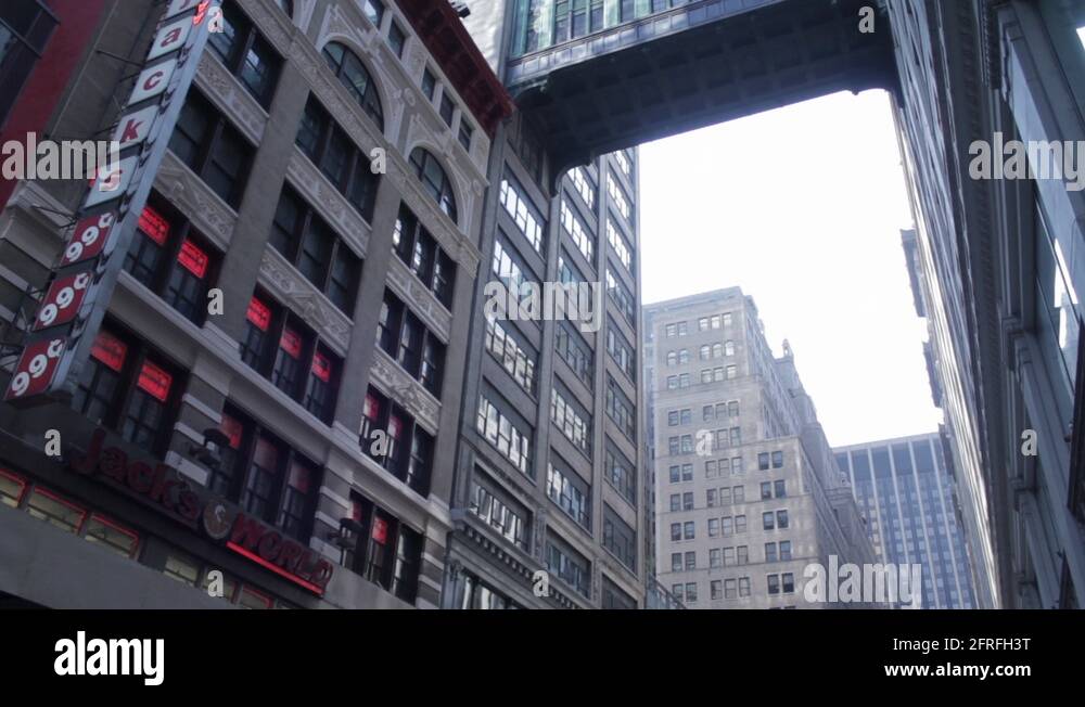 High rise buildings connected by elevated walkway Stock Video Footage ...