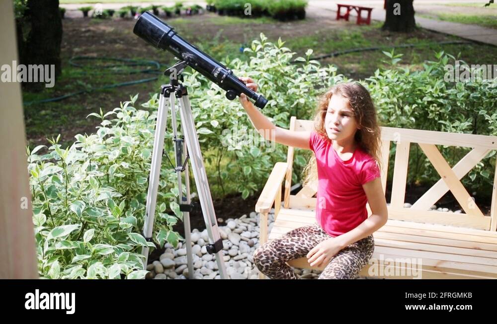 Girl looking through telescope Stock Videos & Footage - HD and 4K Video ...