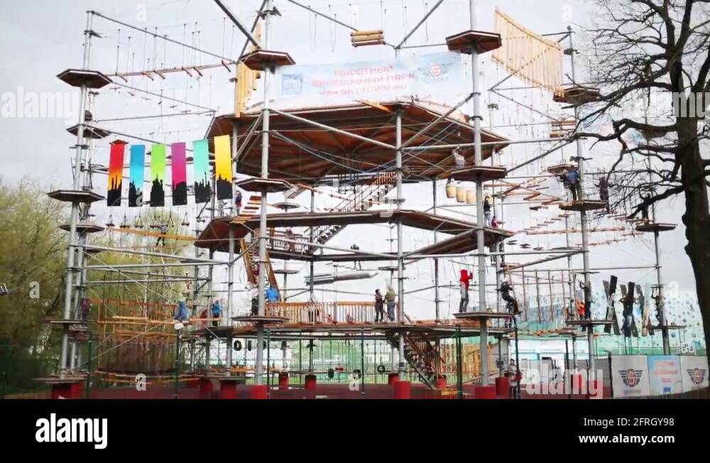 Multi-storey construction of rope park with pillars, ropes, ladders ...