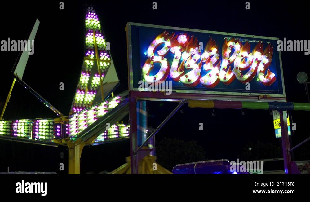 Sizzler carnival ride spinning people around 4k Stock Video Footage - Alamy