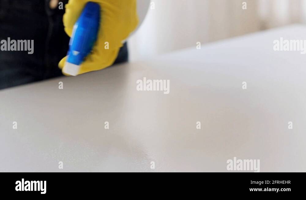 hand spraying cleanser and cleaning table with rag Stock Video Footage ...