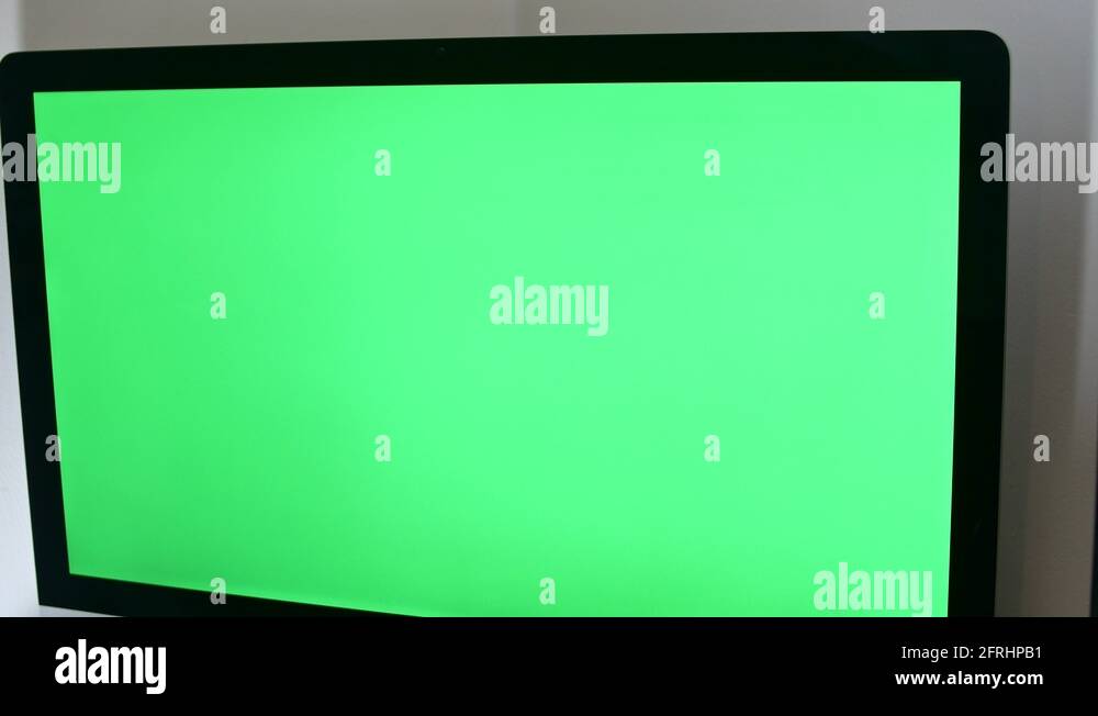 Tilt Down Over An Editor's Working Station, Green Screen Monitor, Side ...