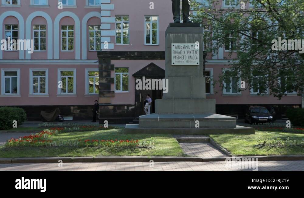 Vladimir Ilyich Ulyanov, alias Lenin is in front of entrance of old ...