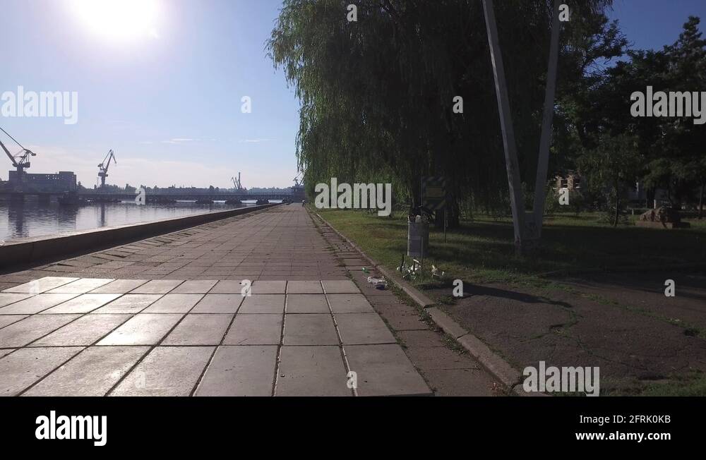 Movement along the embankment of the river, paving slabs, bridge Stock ...