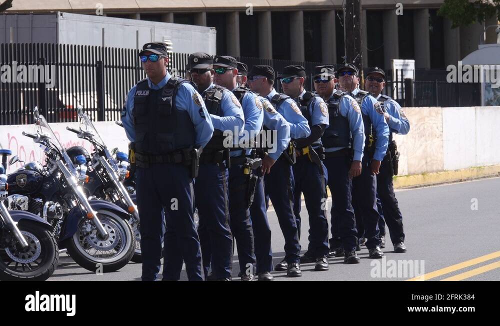 Police riot squad in single line formation front view Stock Video ...